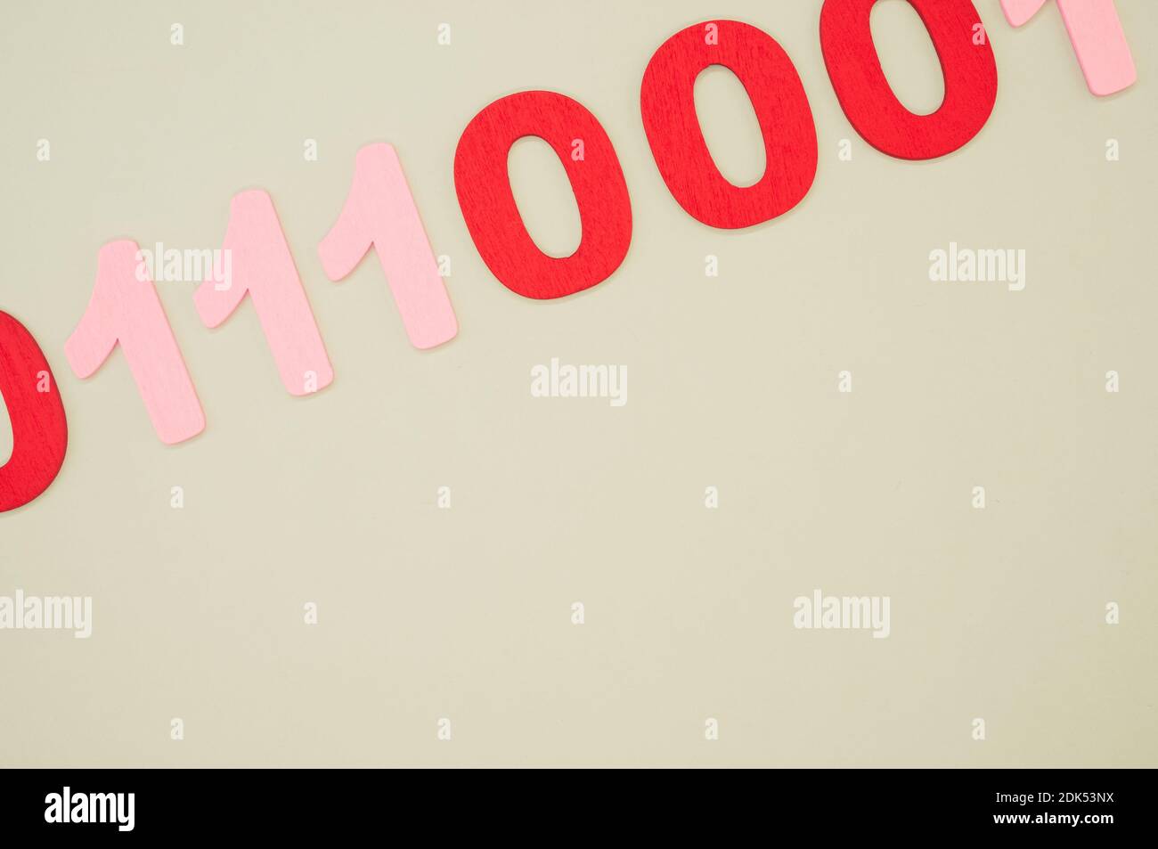 A top view of red and pink binary codes on a white surface Stock Photo ...