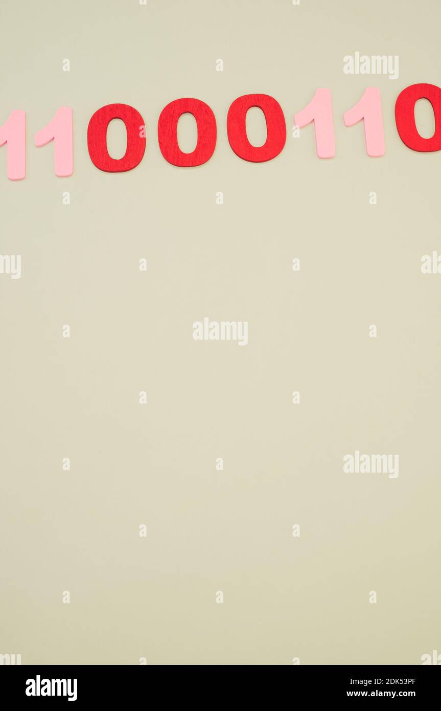 A vertical of red and pink binary codes on a white surface Stock Photo ...