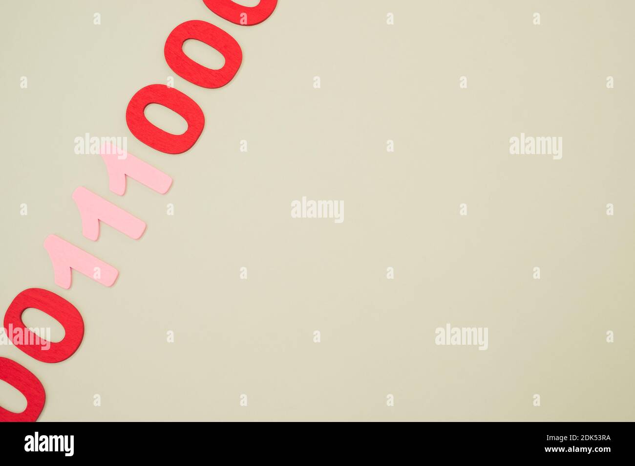 A top view of red and pink binary codes on a white surface Stock Photo ...