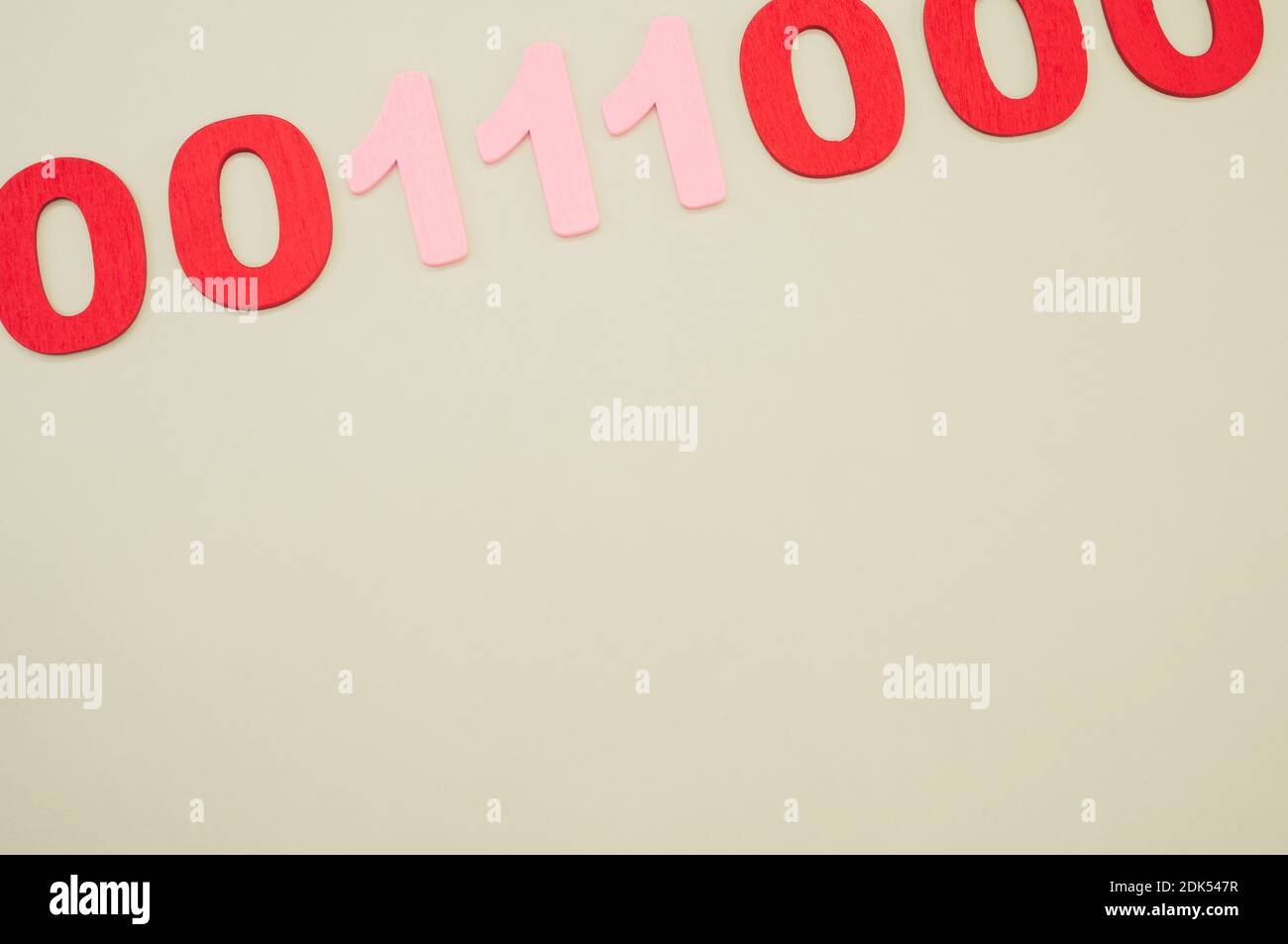 A top view of red and pink binary codes on a white surface Stock Photo ...