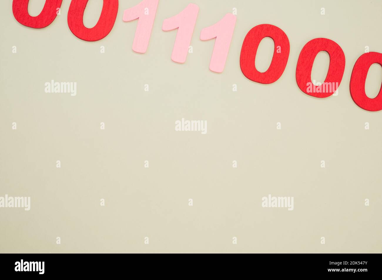 A top view of red and pink binary codes on a white surface Stock Photo ...
