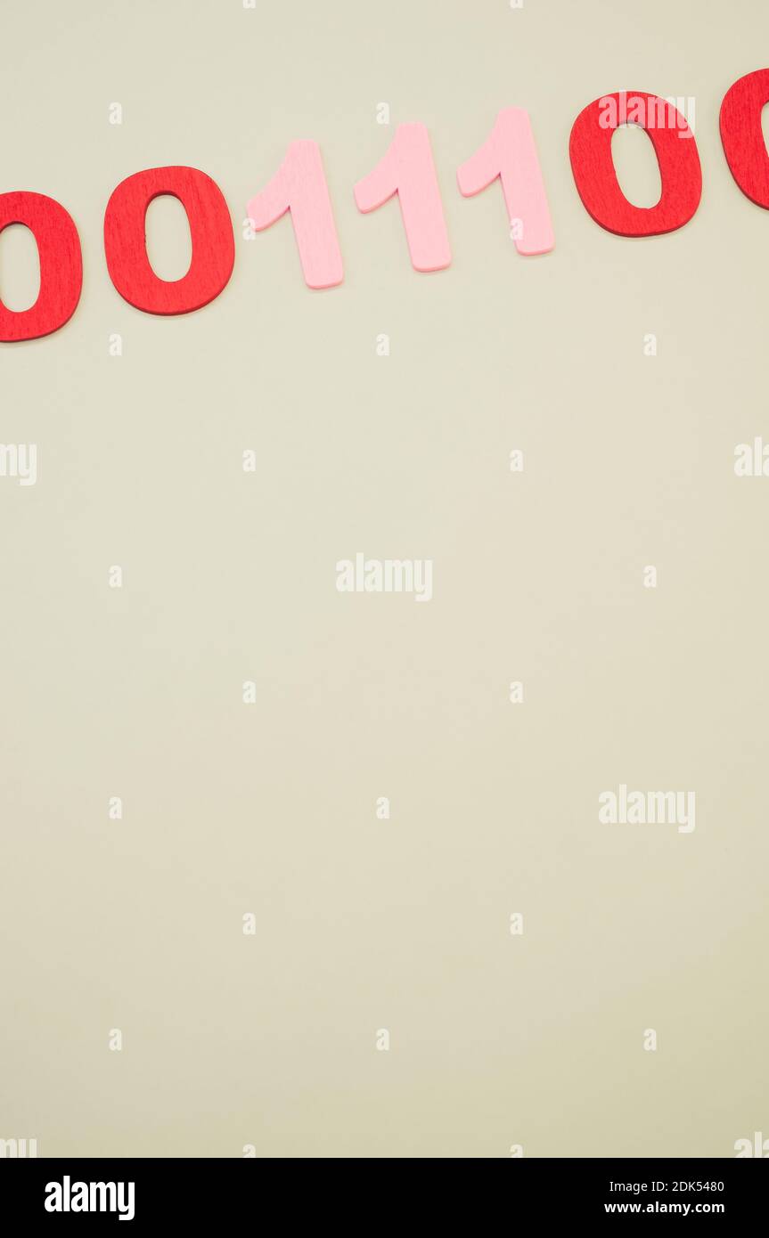 A vertical of red and pink binary codes on a white surface Stock Photo ...