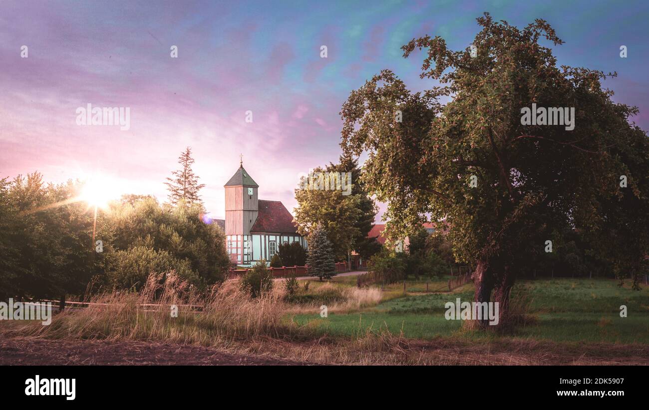 Church between trees hi-res stock photography and images - Alamy