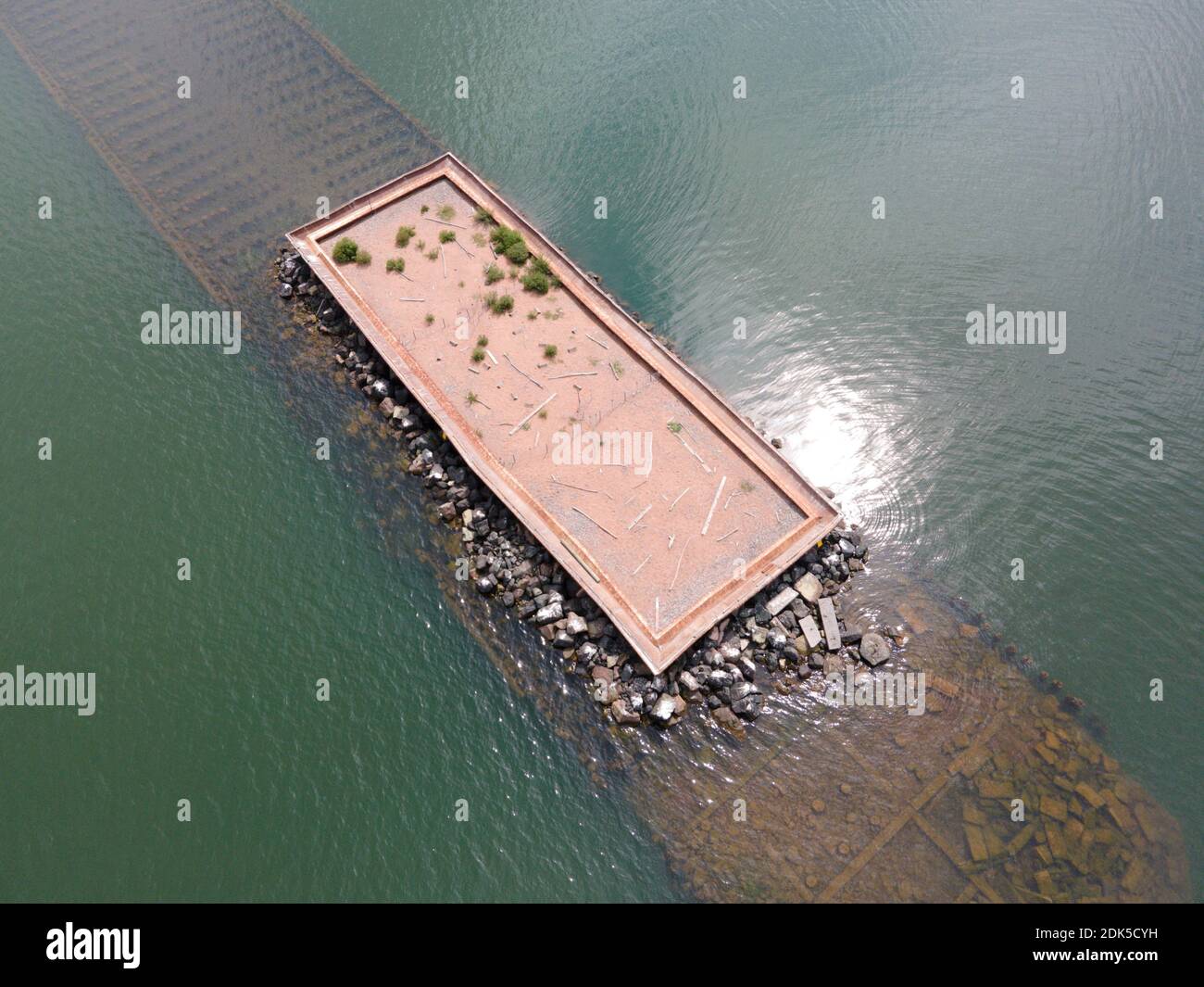 An aerial view of a pier in the middle of the water Stock Photo - Alamy
