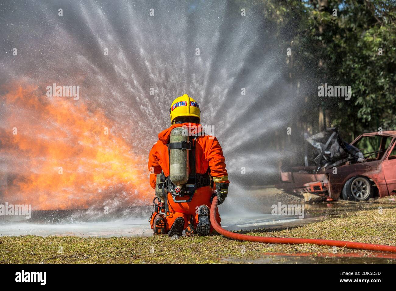 Firemen Using Hose High Resolution Stock Photography and Images - Alamy