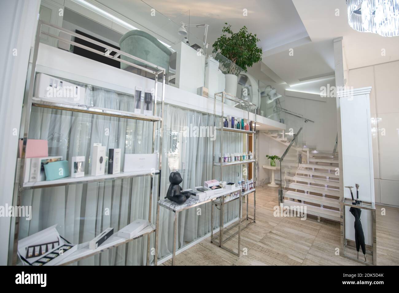 White hallway. White bright hallway of the beauty center with shelves ...