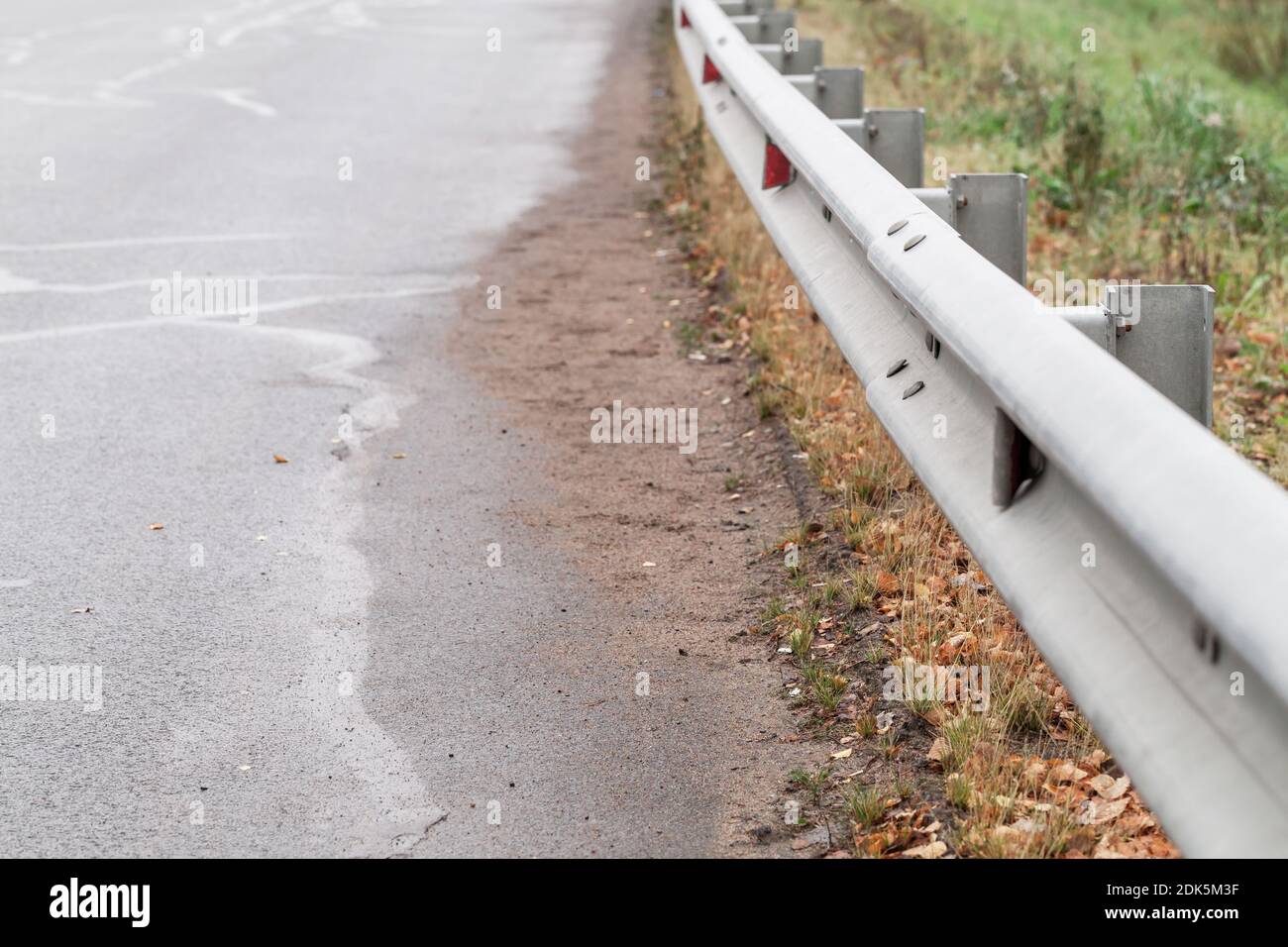 Metal guardrail on a highway roadside, safety equipment Stock Photo - Alamy