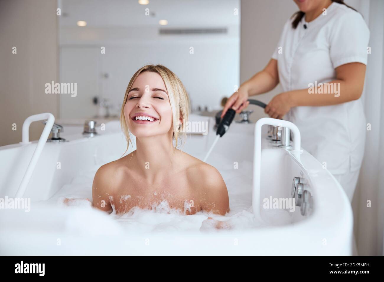 Thoughtful charming woman having leisure in water Stock Photo - Alamy