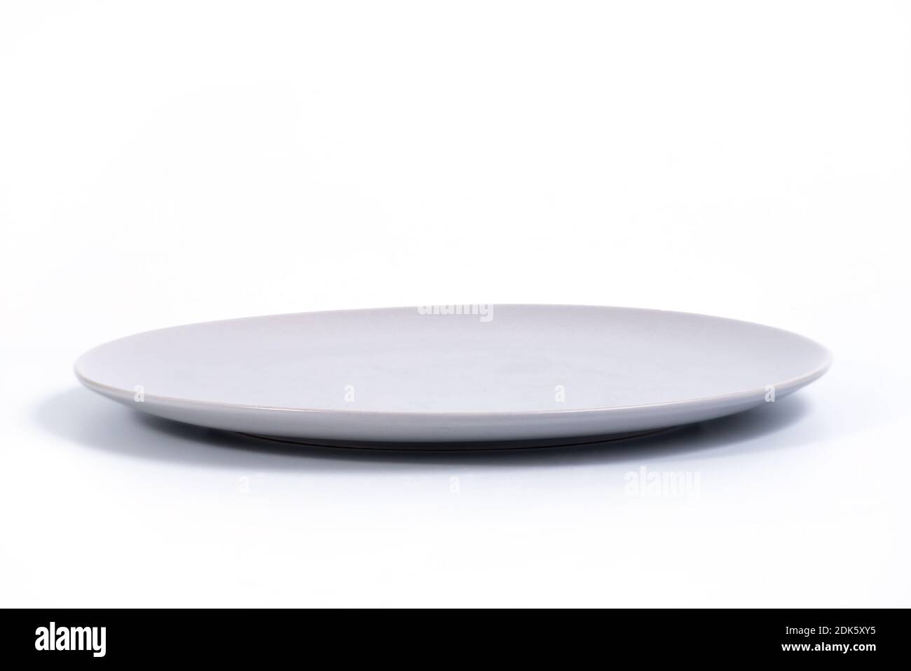 Large Empty Grey plate isolated on white background side view ...