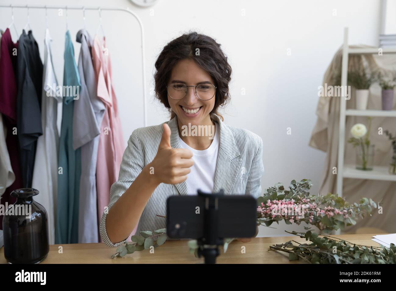 Happy woman vlogger sharing secrets of floral design with followers ...