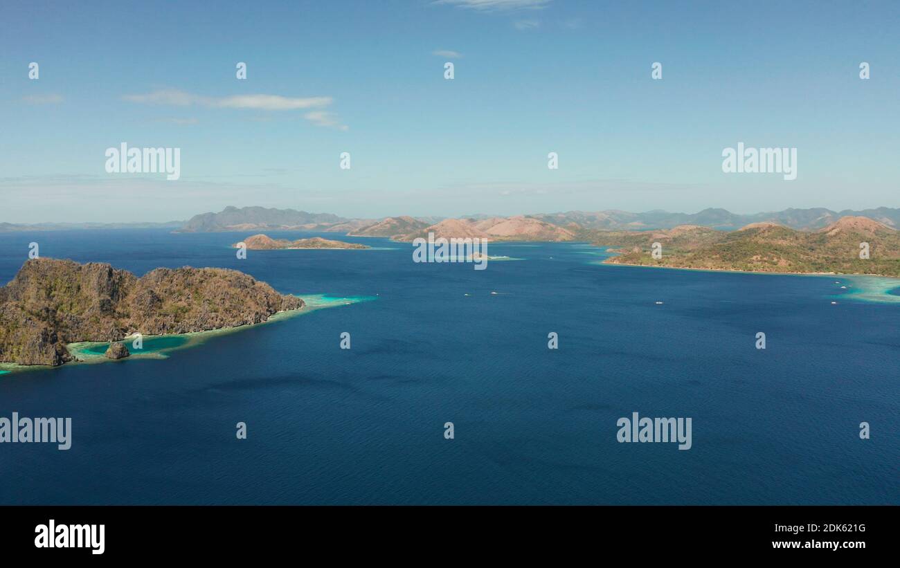aerial view tropical islands with blue lagoons, coral reef and sandy ...