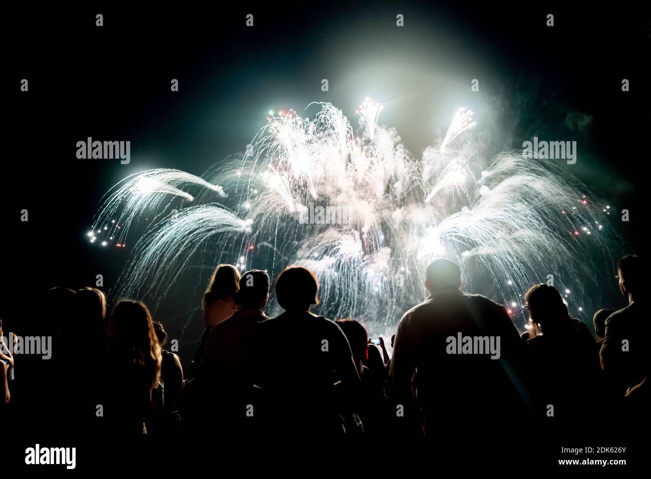 Crowd watching fireworks and celebrating new year eve Stock Photo - Alamy