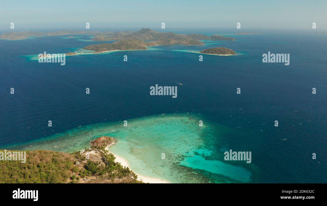 aerial view tropical islands with blue lagoons, coral reef and sandy ...