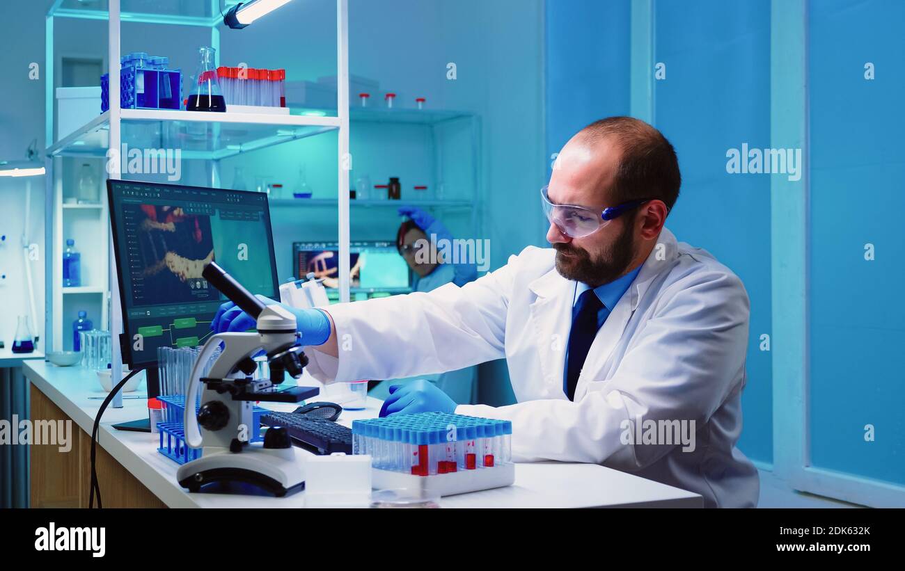 Microbiologist biotechnology researchers working for vaccine ...