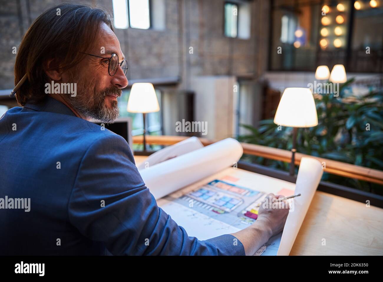 Smart gentleman handling an important paperwork at cozy lounge Stock ...
