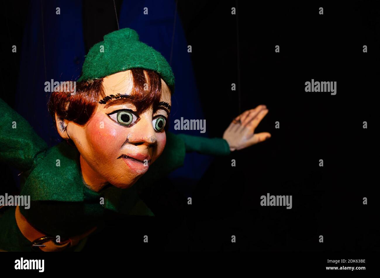 A closeup of a hand made realistic puppets on a black background Stock ...