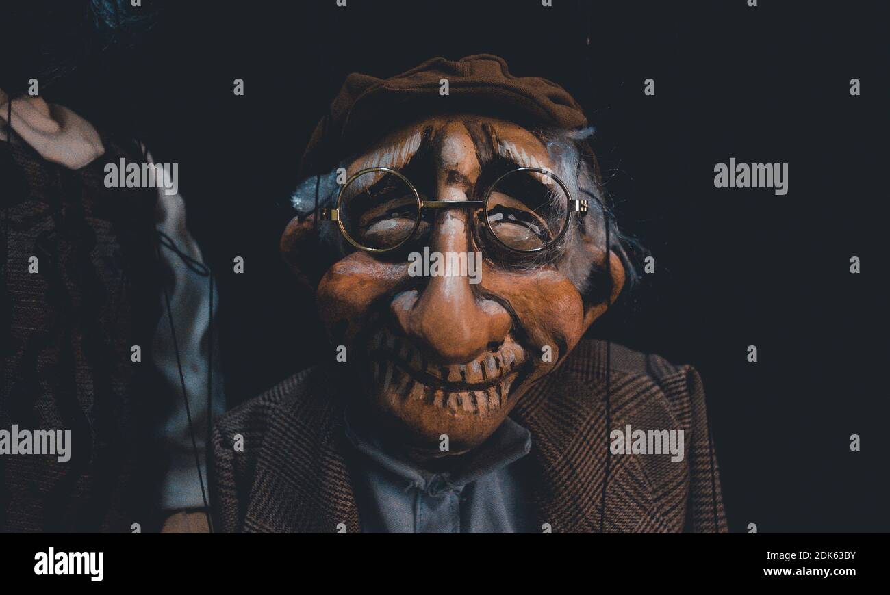 A closeup of a hand made realistic puppets on a black background Stock ...