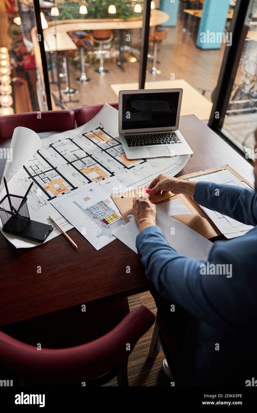 Effective employee using bookmarks to highlight important bits of ...