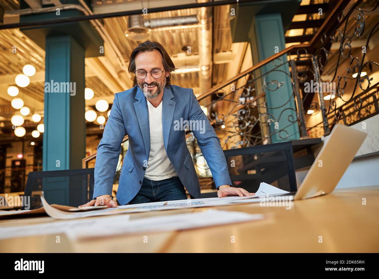 Dedicated employee feeling ready to start a working day Stock Photo - Alamy