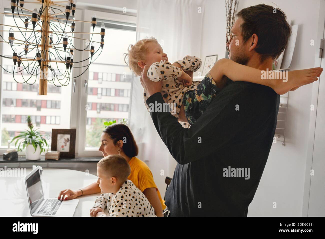Family at home Stock Photo - Alamy