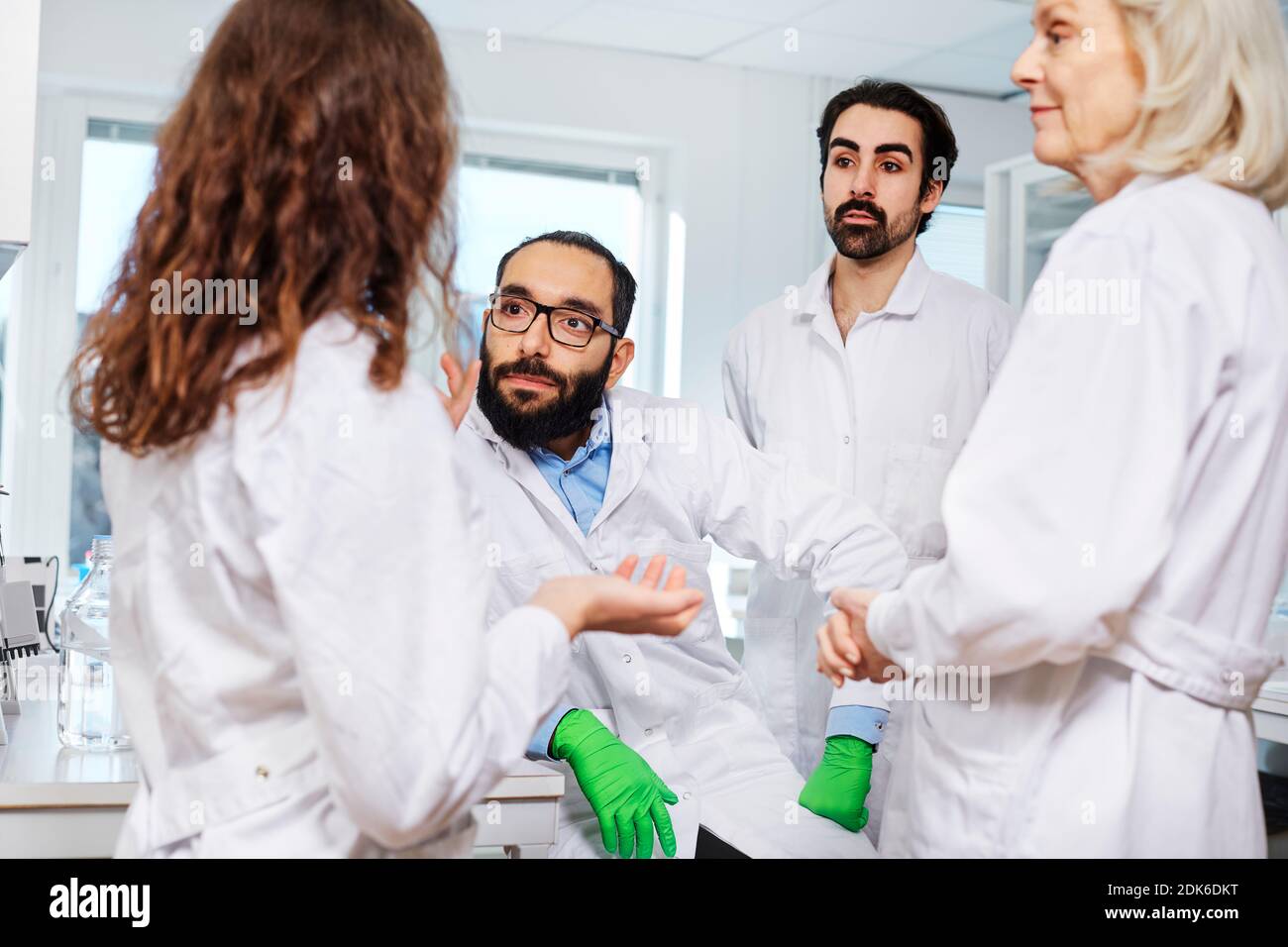 Scientists talking in laboratory Stock Photo - Alamy