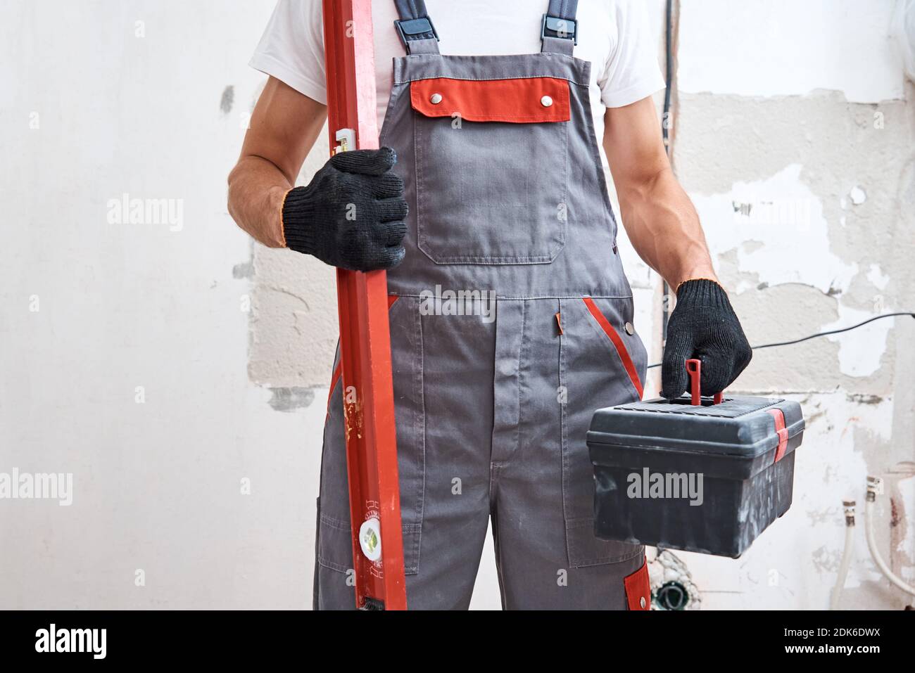 Builder man in uniform with a construction tools. Repair concept Stock ...