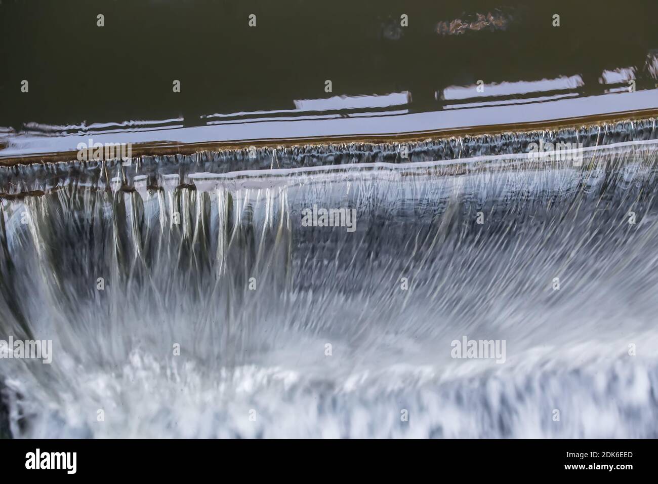 Falling water. Top part of dam with the Stock Photo - Alamy