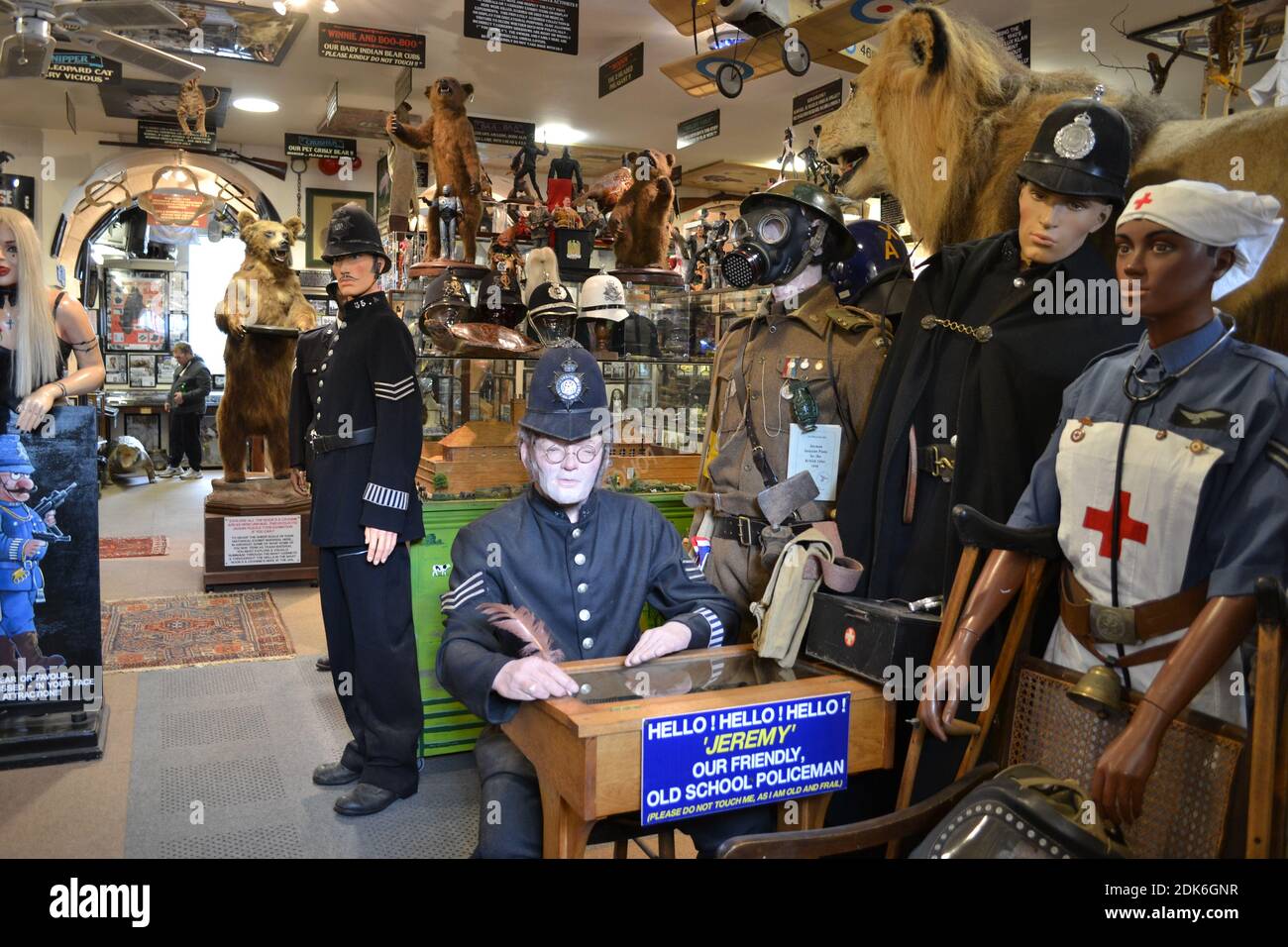 Old fashioned policemens uniforms with helmets at Littledean Jail ...