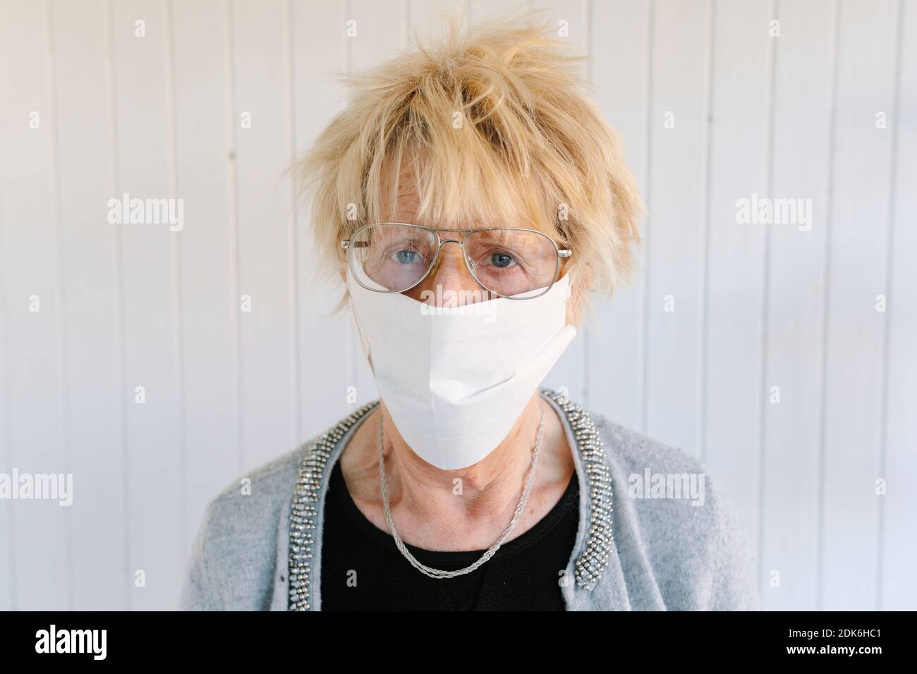 Portrait of older woman wearing face mask Stock Photo - Alamy