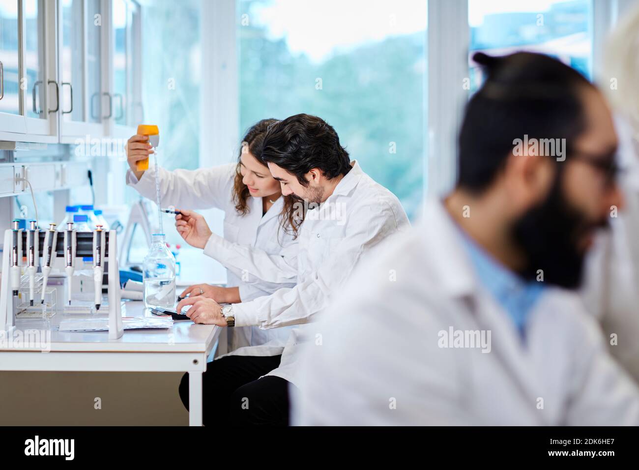 Scientists working in laboratory Stock Photo - Alamy