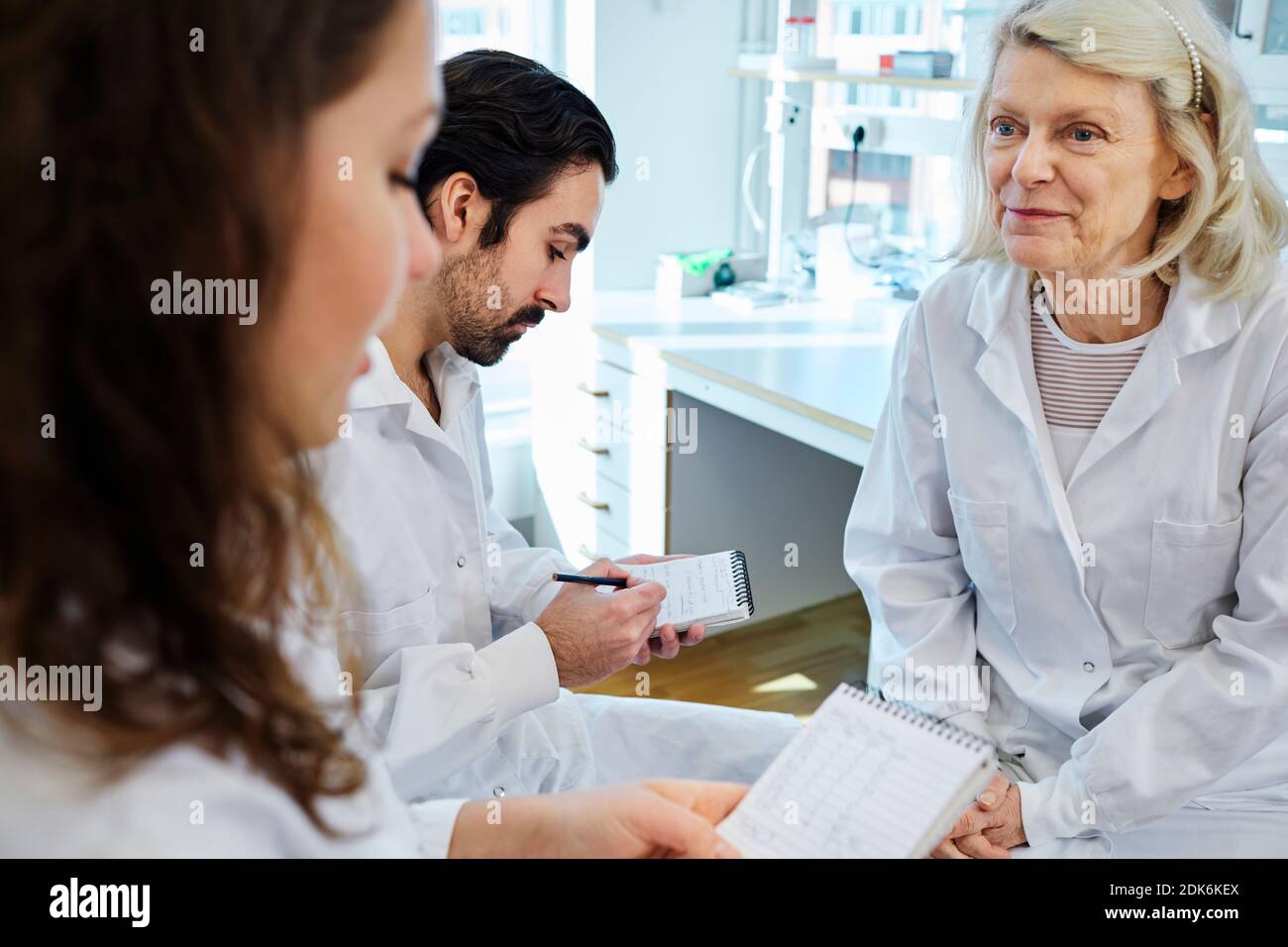 Scientists talking in laboratory Stock Photo - Alamy