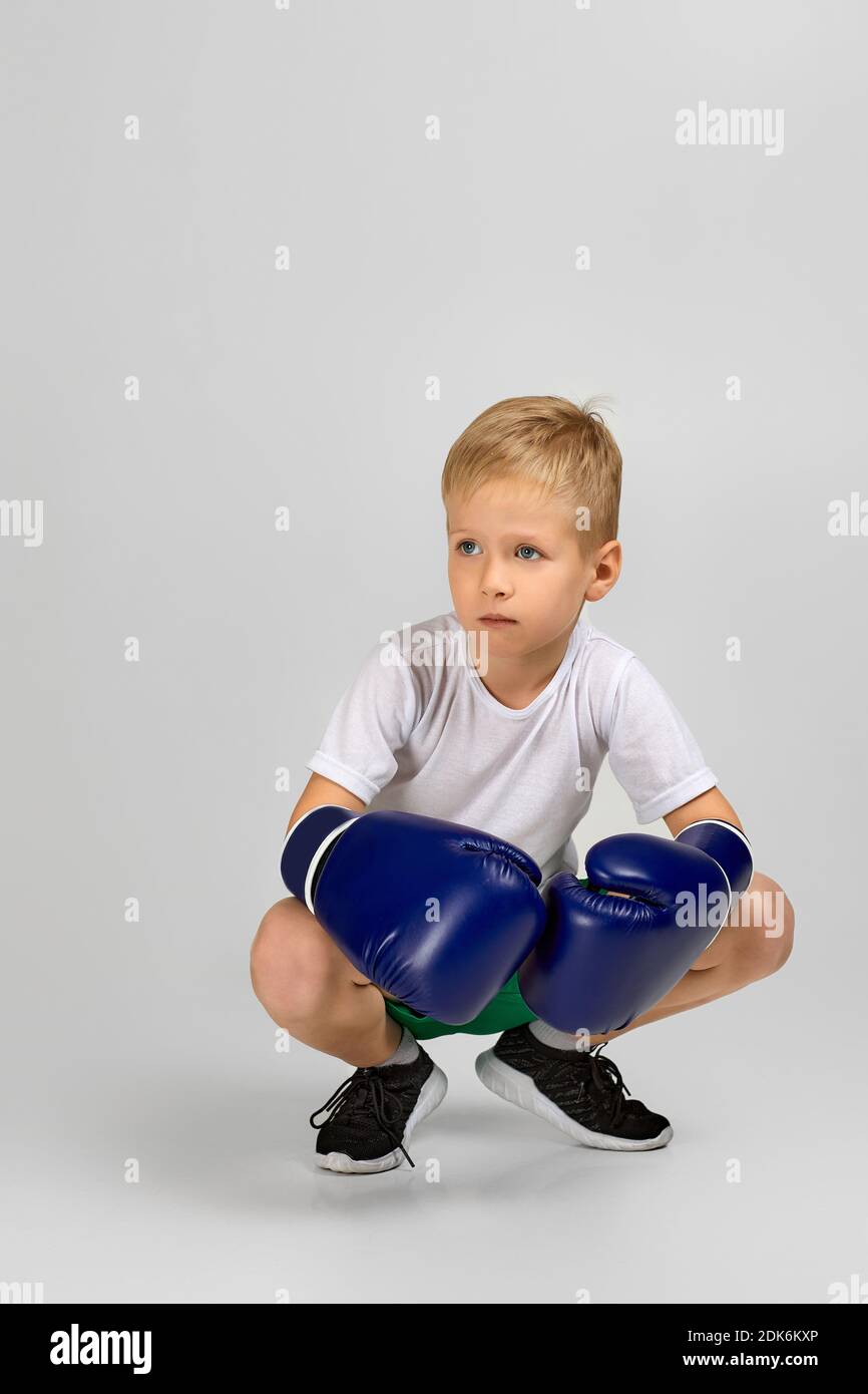 little boxing fighter boy in blue boxer gloves Stock Photo - Alamy