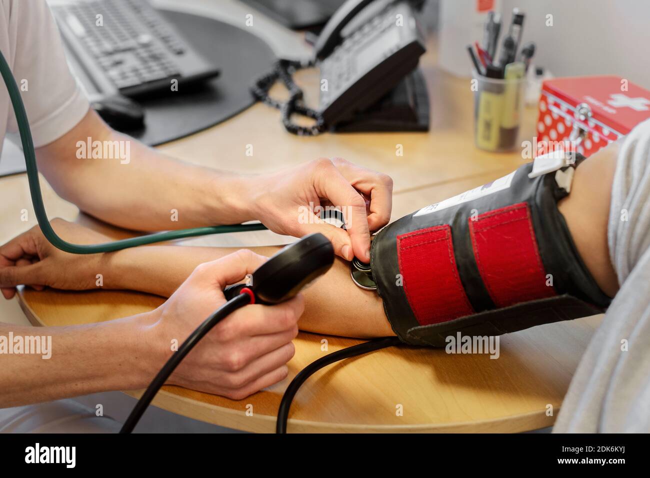 Doctor checking patient's blood pressure Stock Photo - Alamy