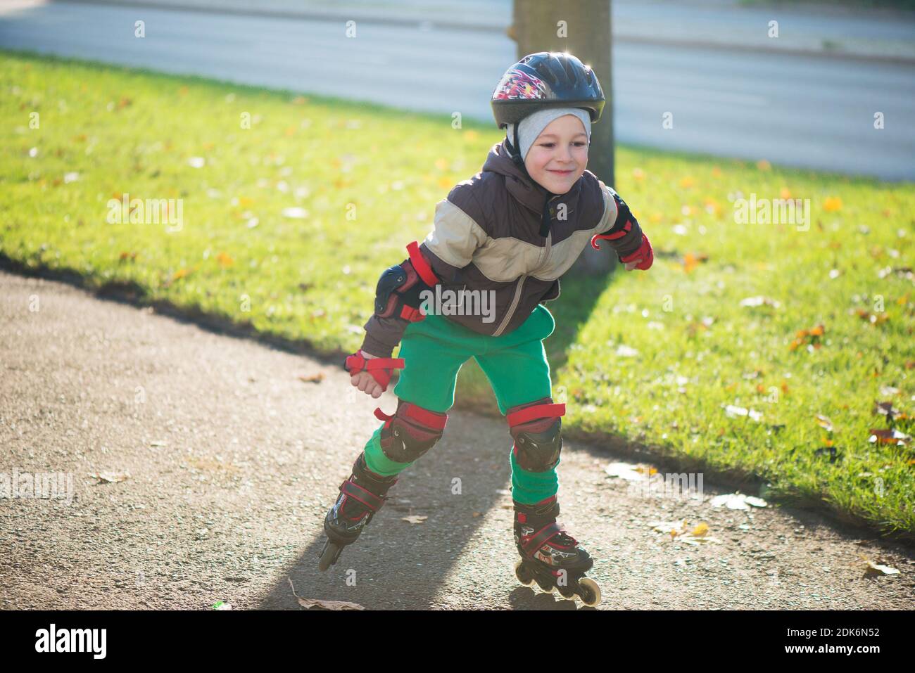 Boy inline skating outdoors hi-res stock photography and images - Alamy