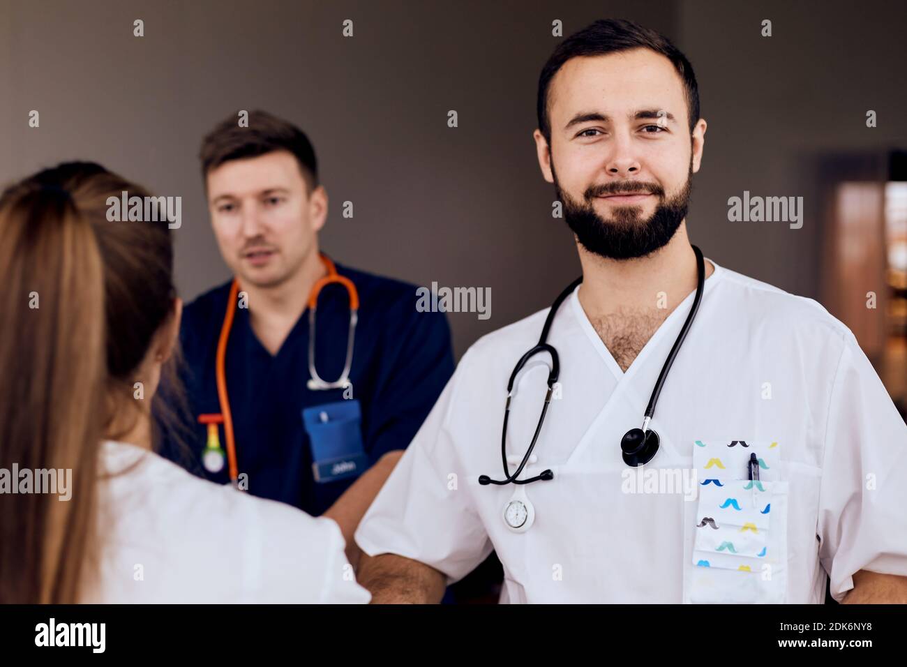 Smiling doctor looking at camera Stock Photo - Alamy