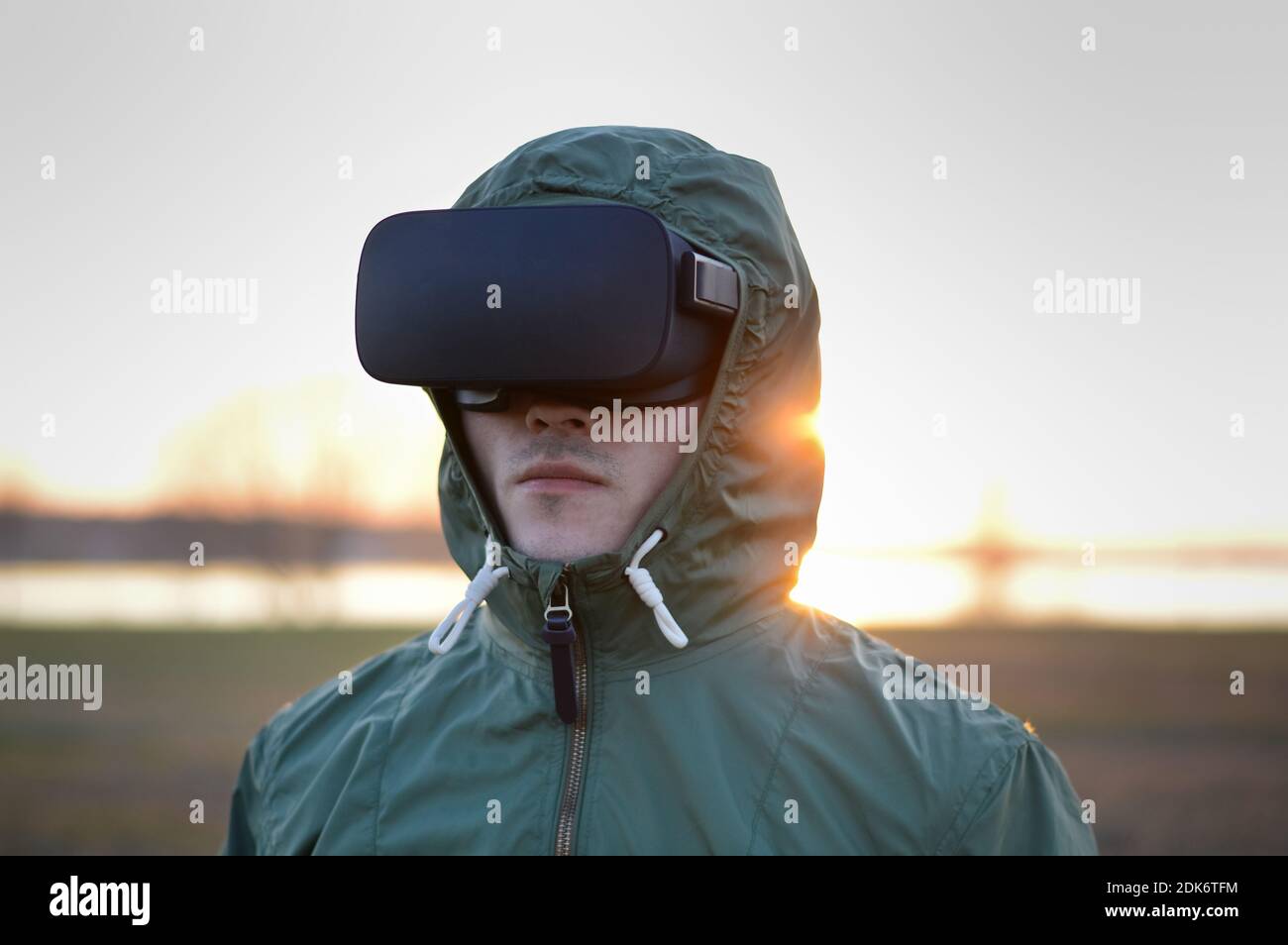 Man Wearing Virtual Reality Simulator Standing On Beach Stock Photo - Alamy