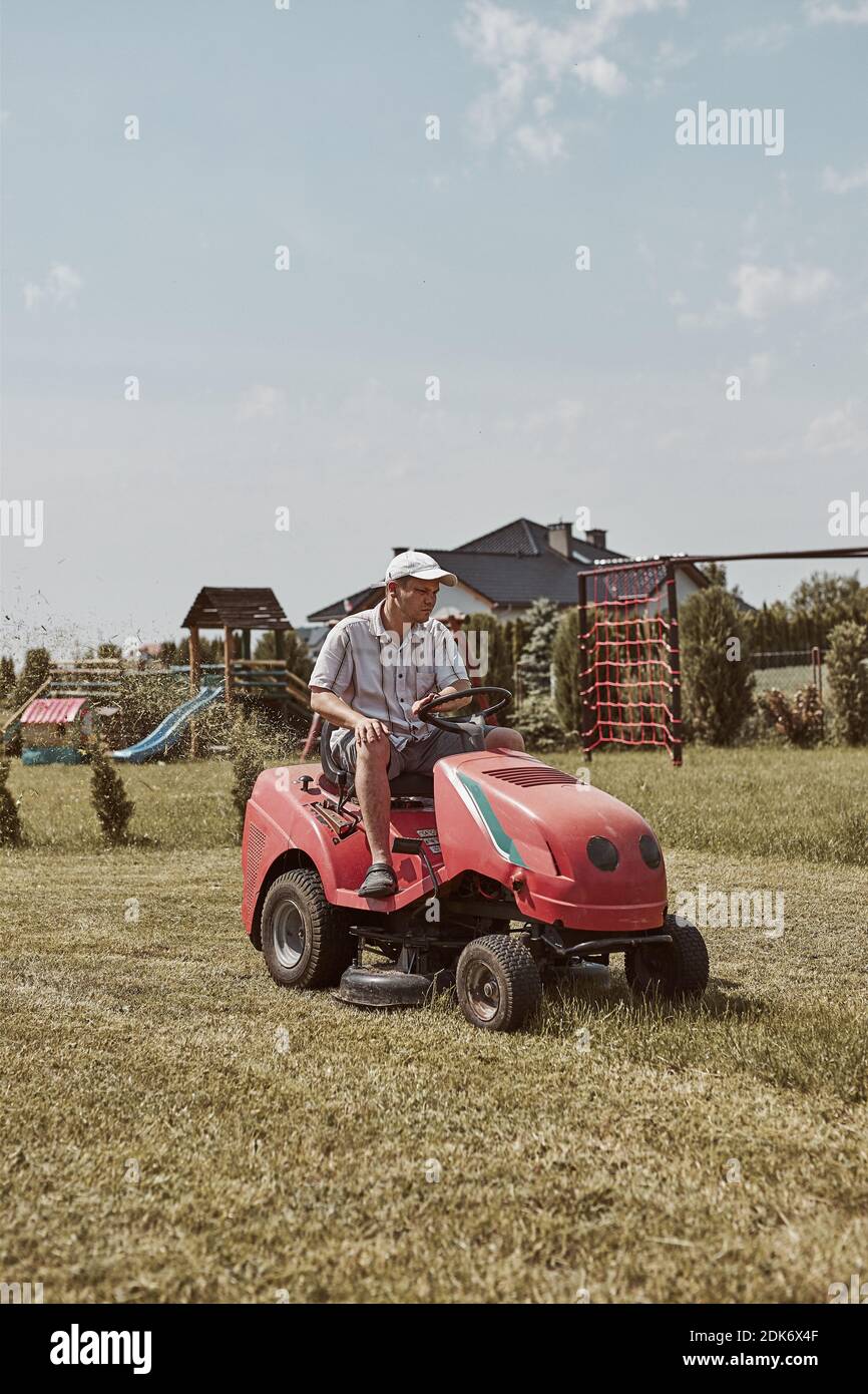 Man sitting on lawn tractor High Resolution Stock Photography and ...