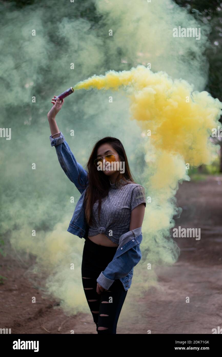 Full Length Portrait Of Woman Standing Against Wall Stock Photo - Alamy