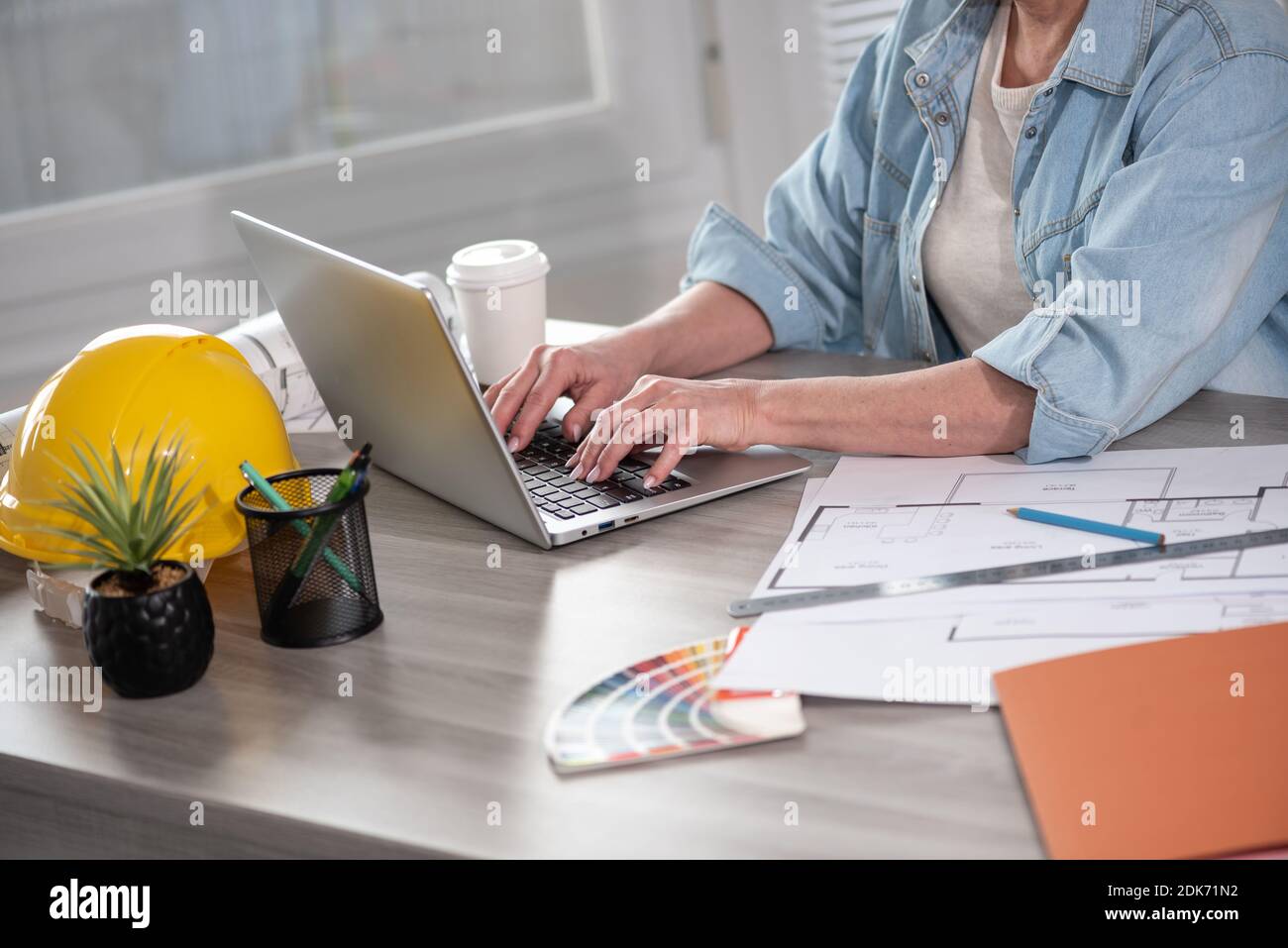 Female architect working on new construction project Stock Photo - Alamy