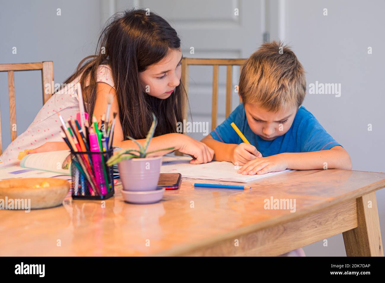 Brother and sister writing hi-res stock photography and images - Alamy