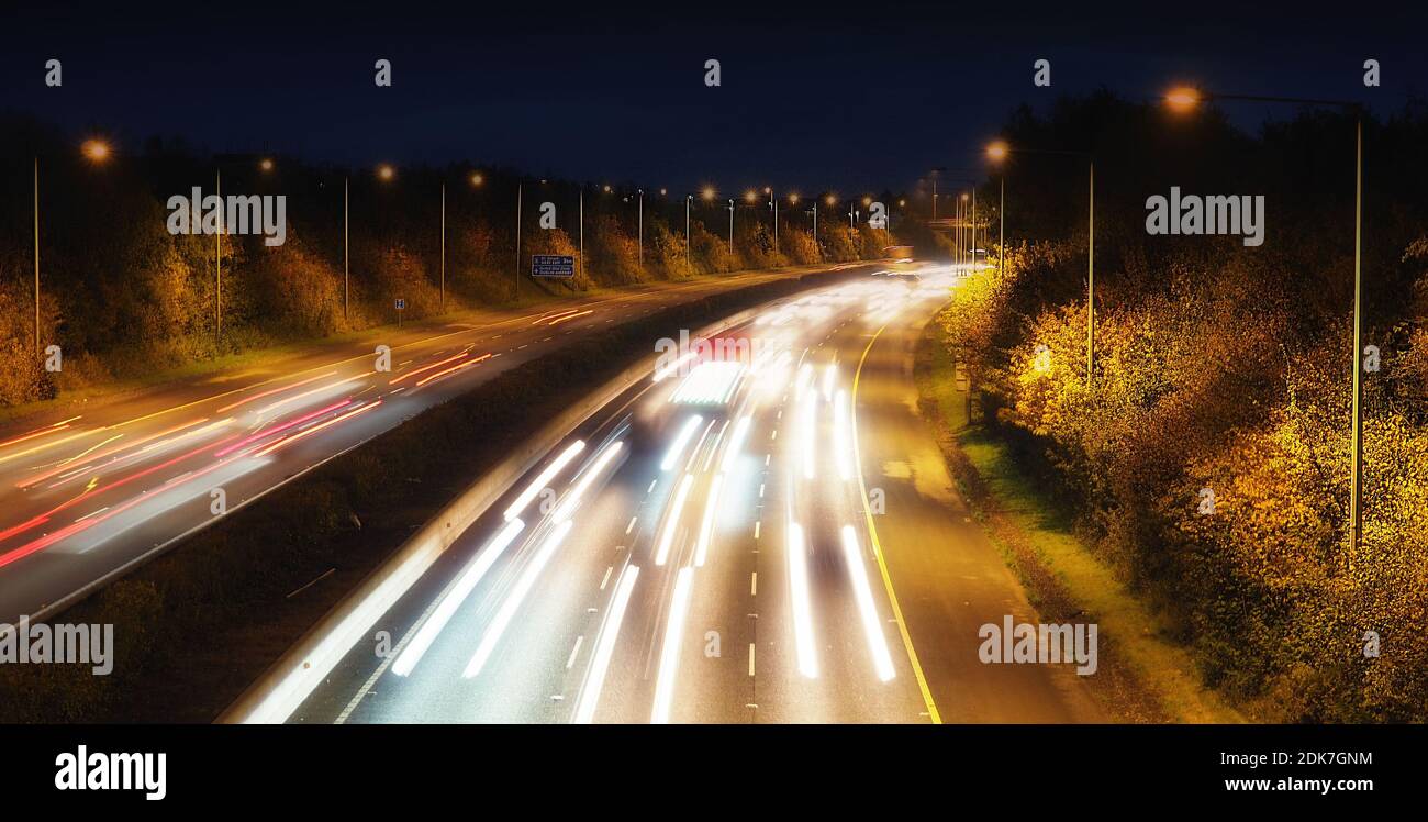 Light Trails On Highway At Night Stock Photo - Alamy