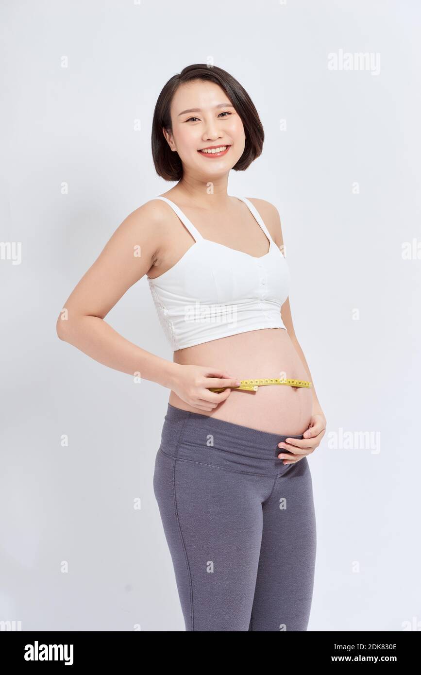 Pregnant woman measuring belly on hi-res stock photography and images ...