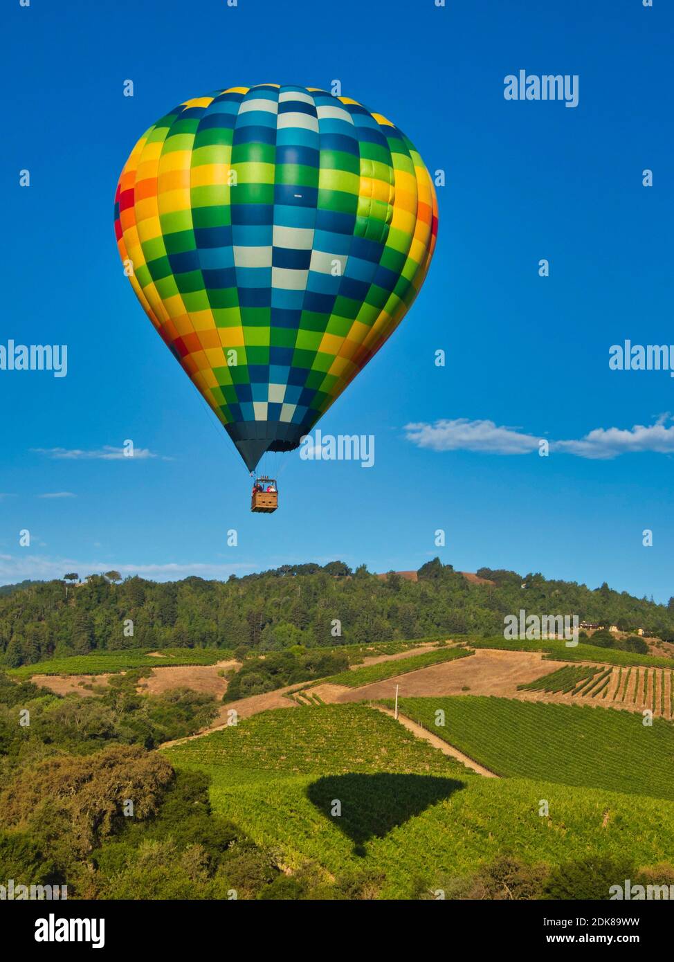 Hot Air Balloon Flying Over Land Stock Photo - Alamy