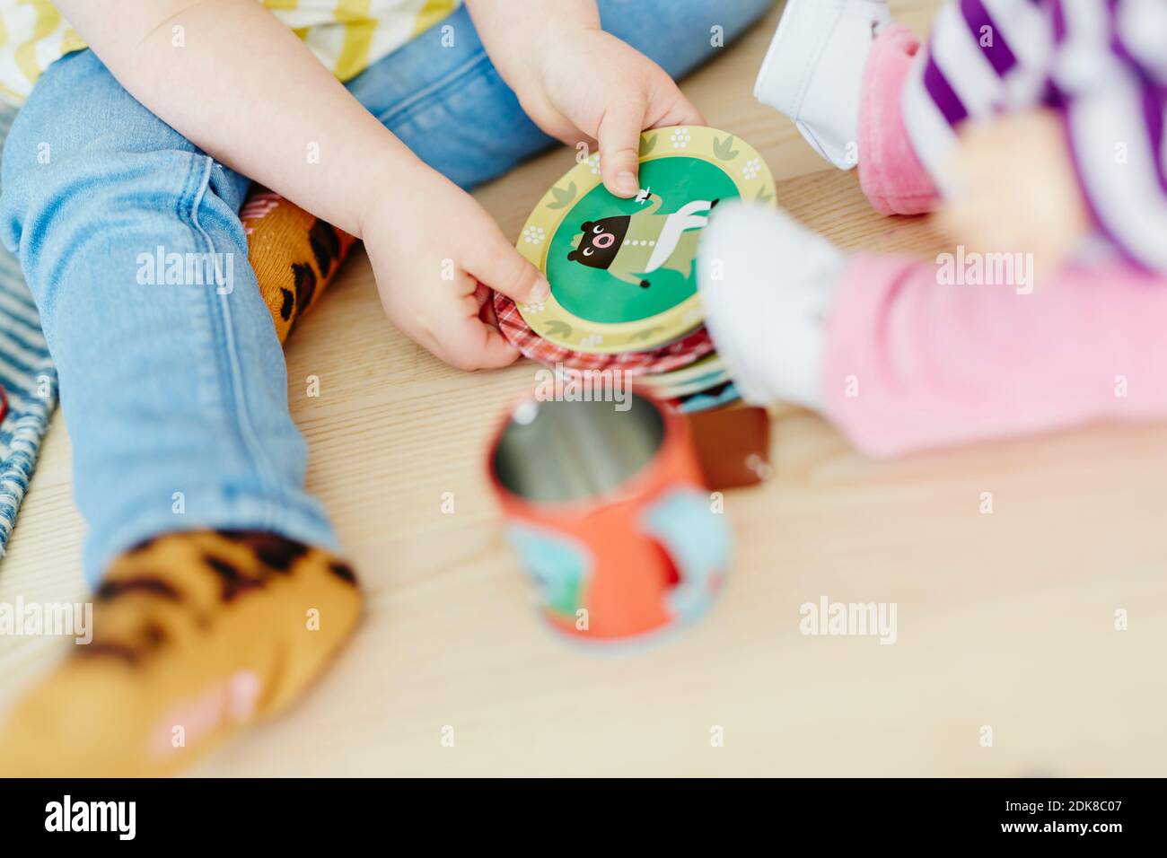 Childs hands holding toys Stock Photo - Alamy
