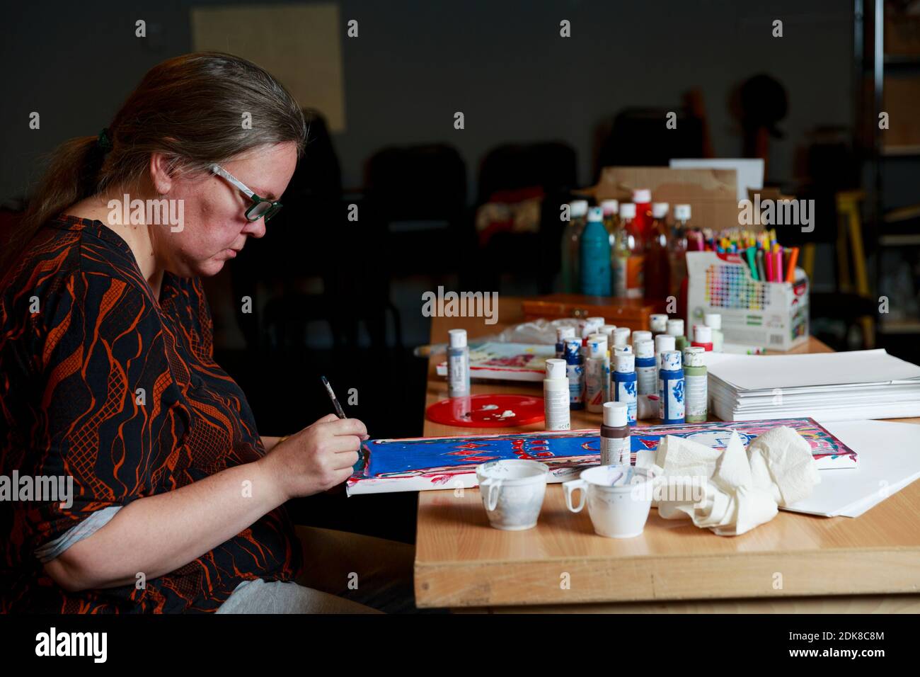 Mature woman painting Stock Photo - Alamy