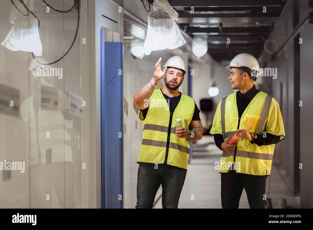 Workers at construction site Stock Photo - Alamy