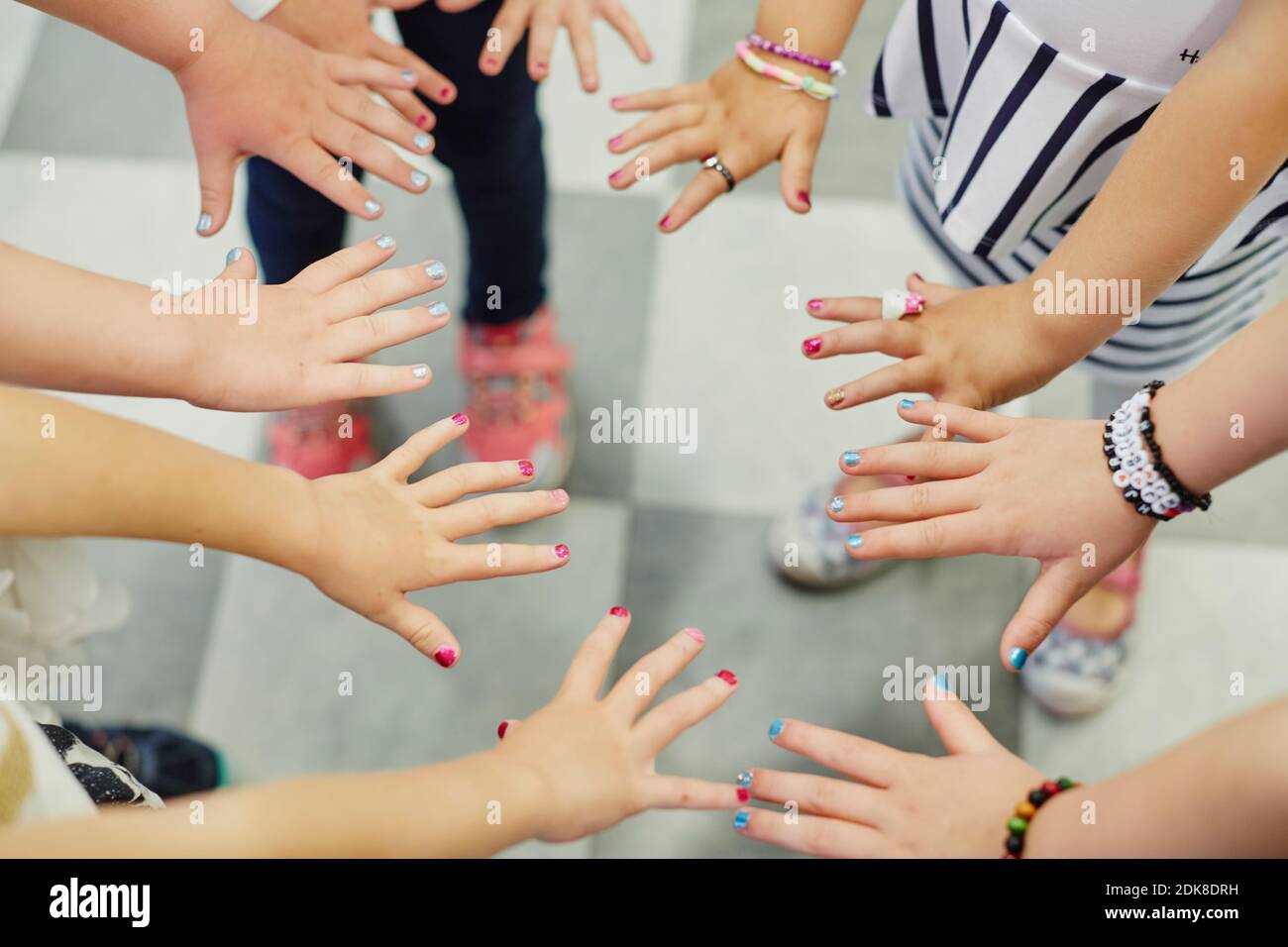 Girls showing painted nails Stock Photo - Alamy
