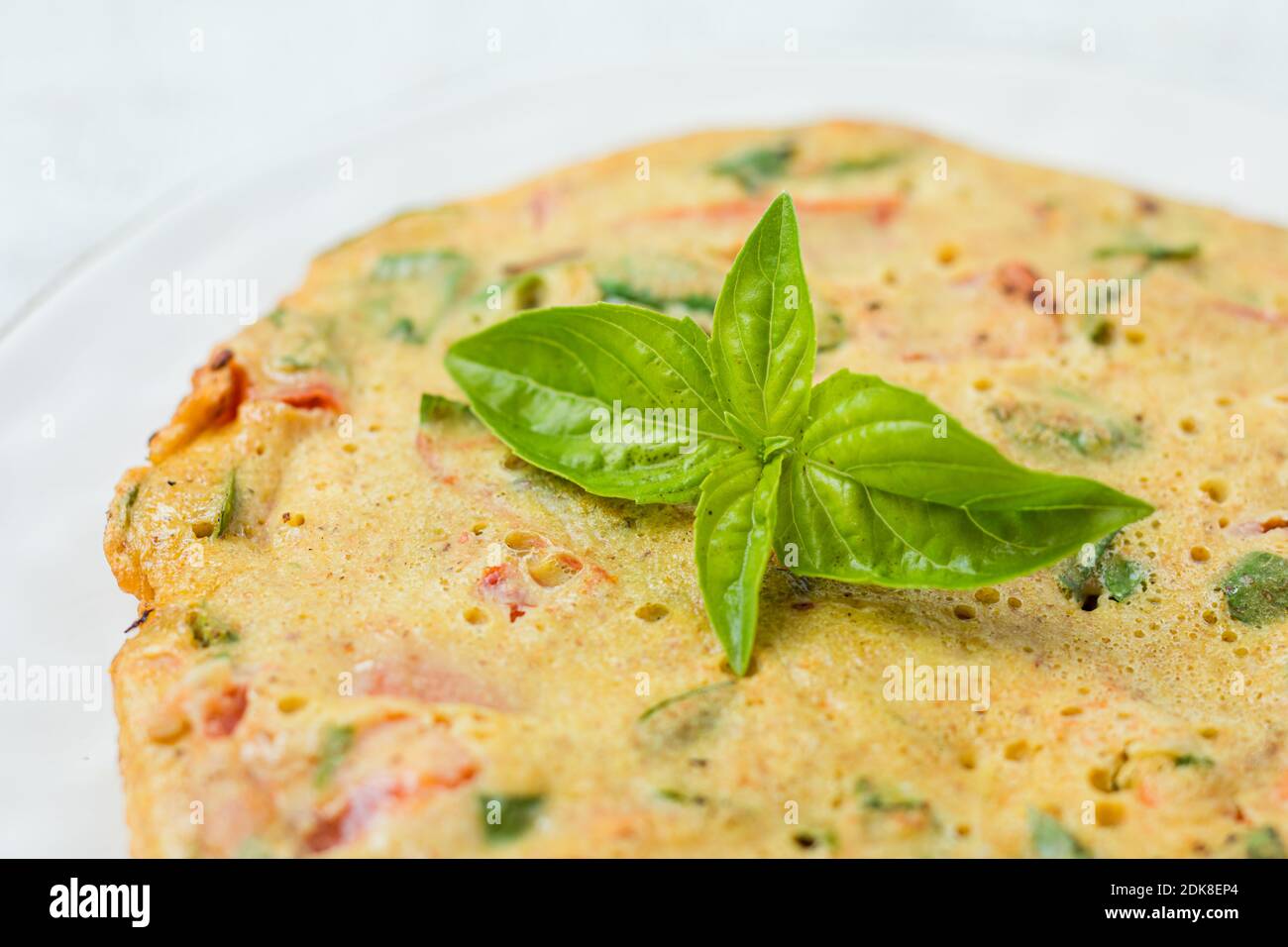 Italian style healthy steamed omelet with vegetables Stock Photo - Alamy