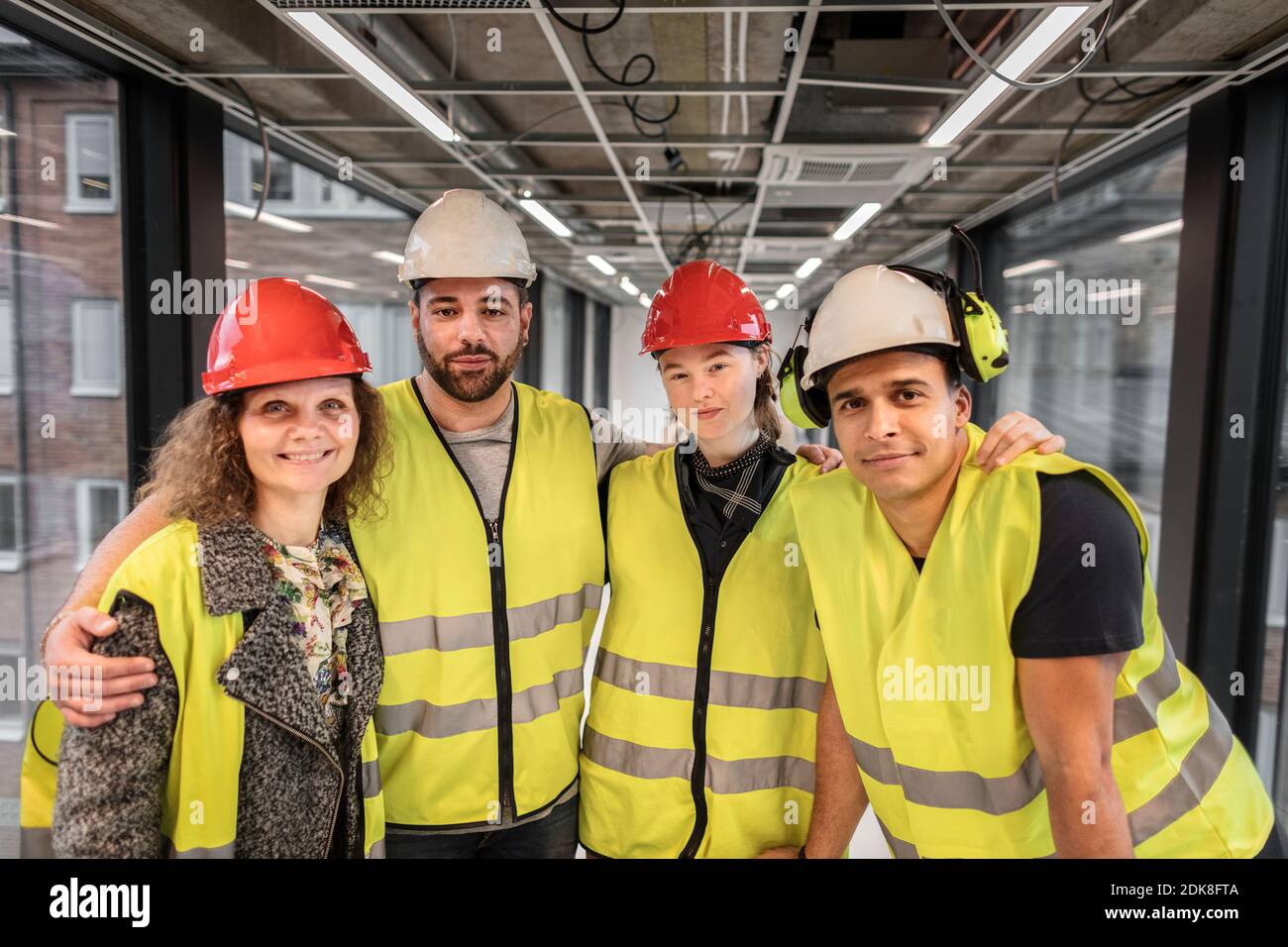 Workers at construction site Stock Photo - Alamy