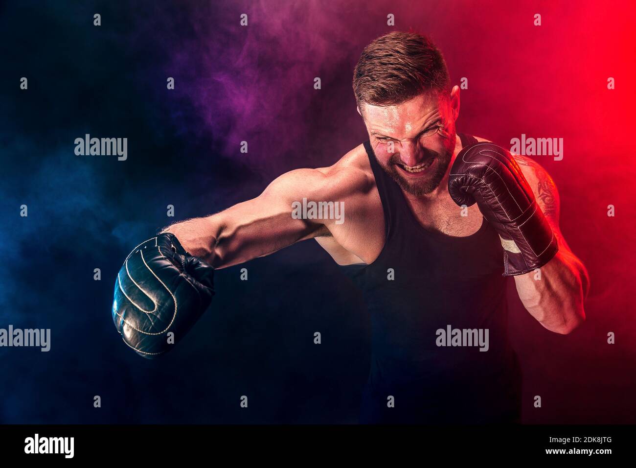 Bearded tattooed sportsman muay thai boxer in black undershirt and ...